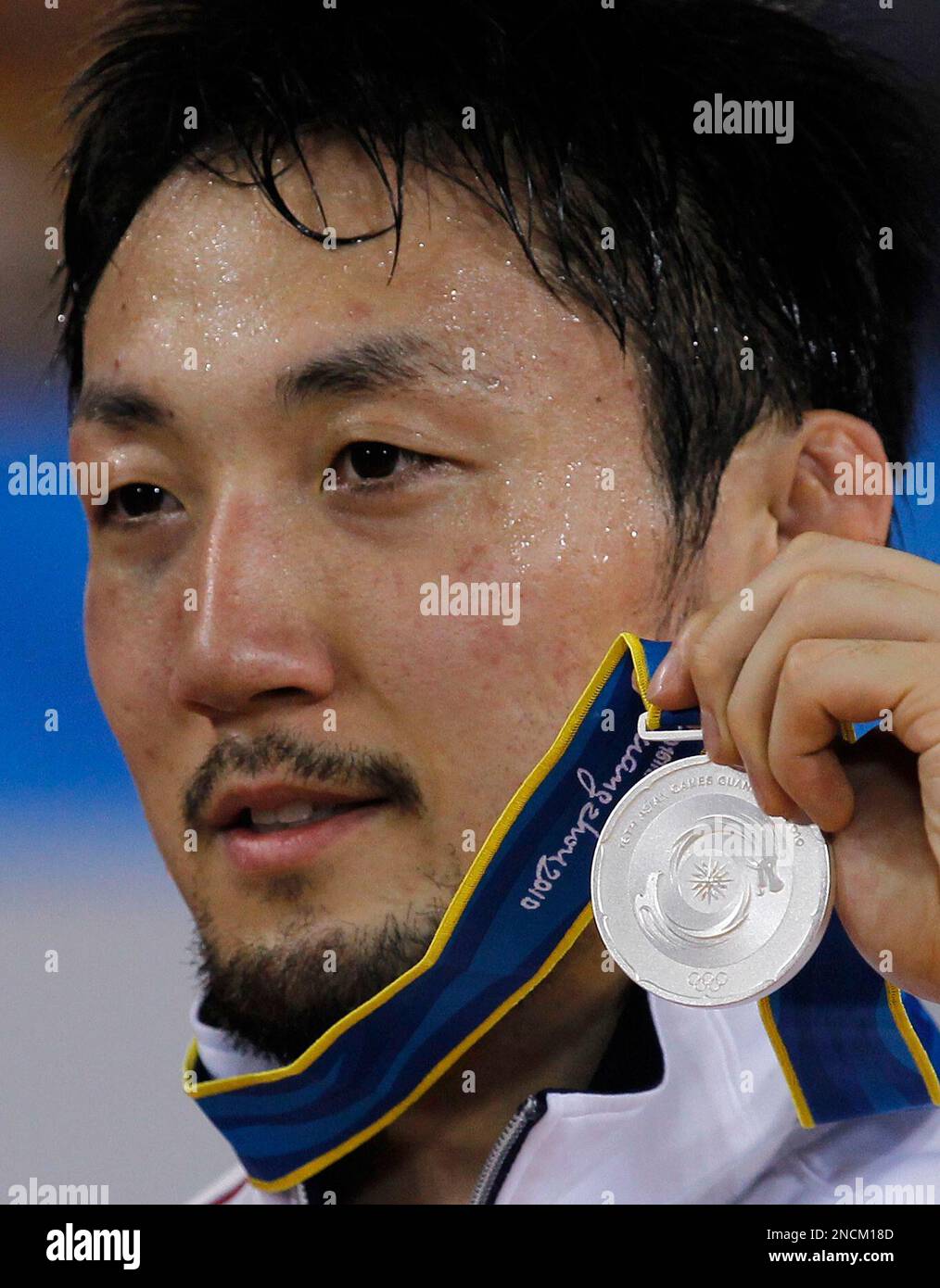 Japan's Kazuyuki Nagashima poses with his silver medal after defeated ...
