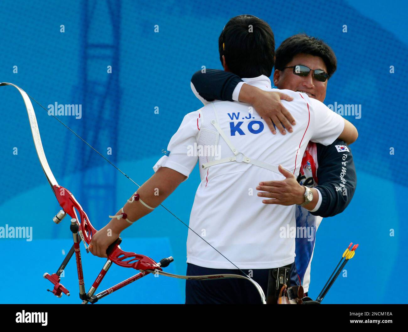 South Korea's Kim Woo-jin, left, celebrates with coach Yang Chang-hun ...