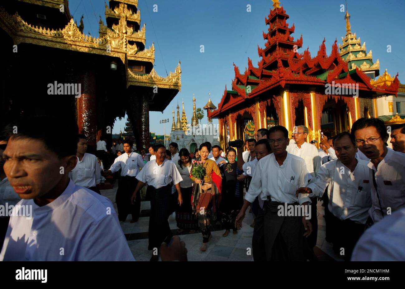 Myanmar's pro-democracy leader Aung San Suu Kyi smiles at devotees as ...