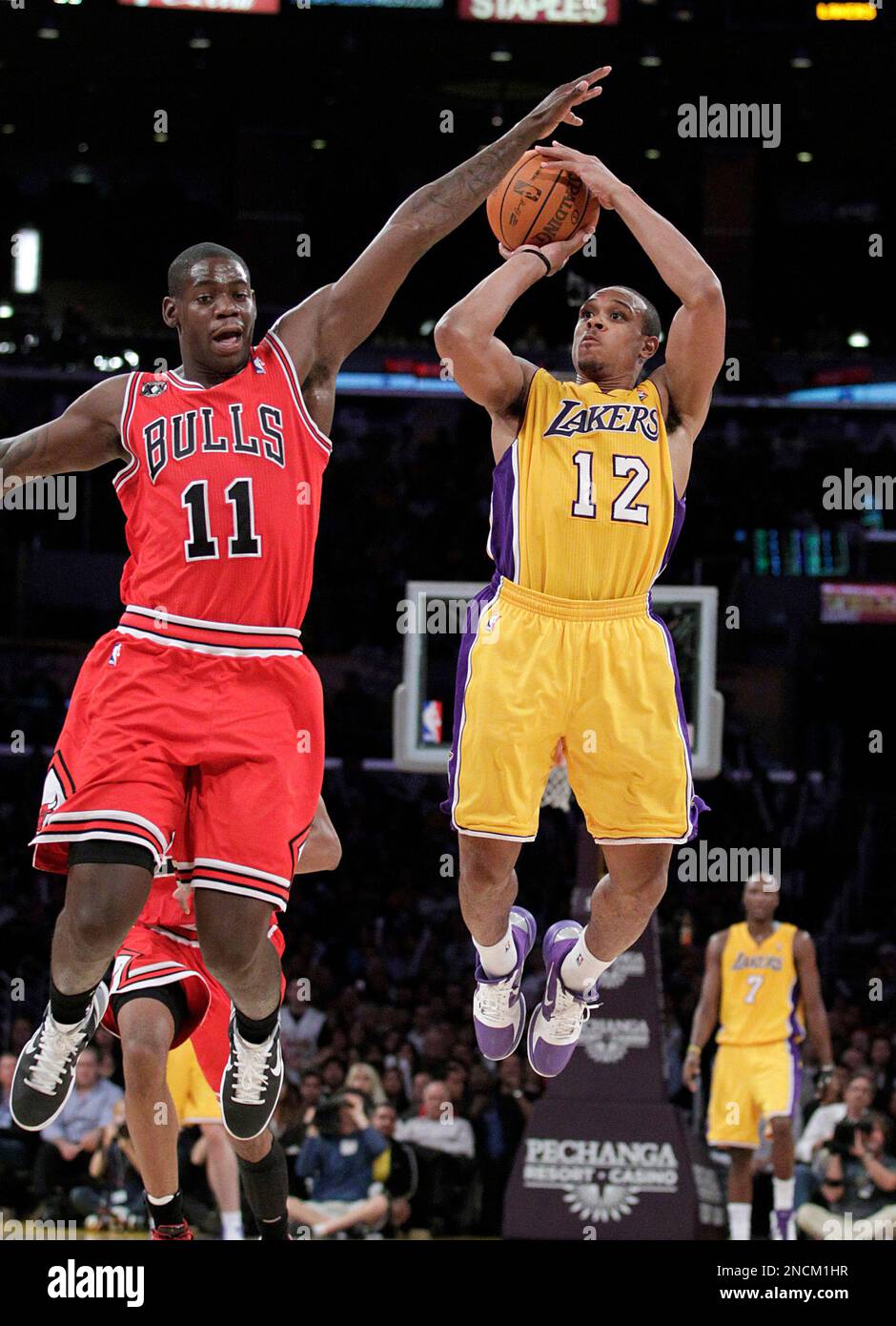 Los Angeles Lakers point guard Shannon Brown, right, shoots as he is ...