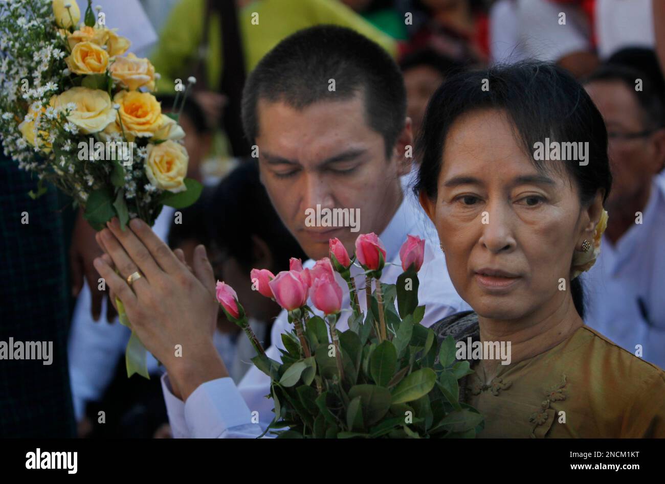 Myanmar's pro-democracy leader Aung San Suu Kyi, right and her son Kim ...