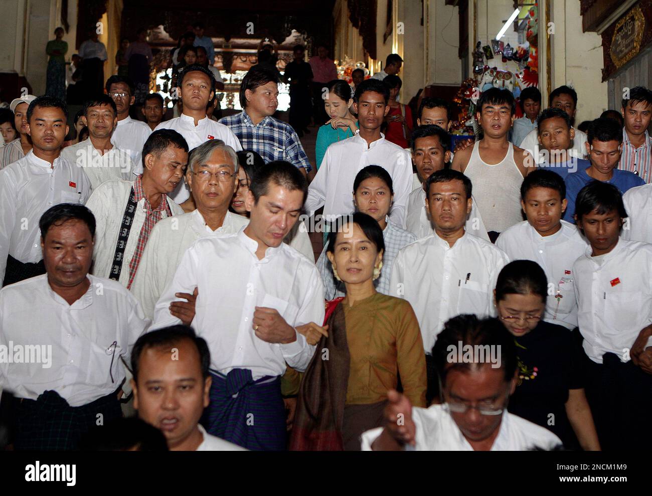 Myanmar's pro-democracy icon Aung San Suu Kyi, center right, and her ...