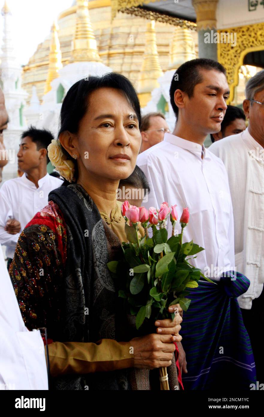 Myanmar's pro-democracy icon Aung San Suu Kyi and her son Kim Aris, right, pay a visit to ...