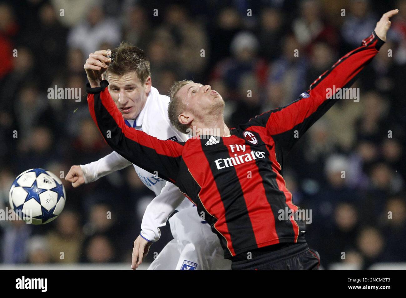 Auxerre's Valter Birsa, left, challenges for the ball with AC Milan's ...
