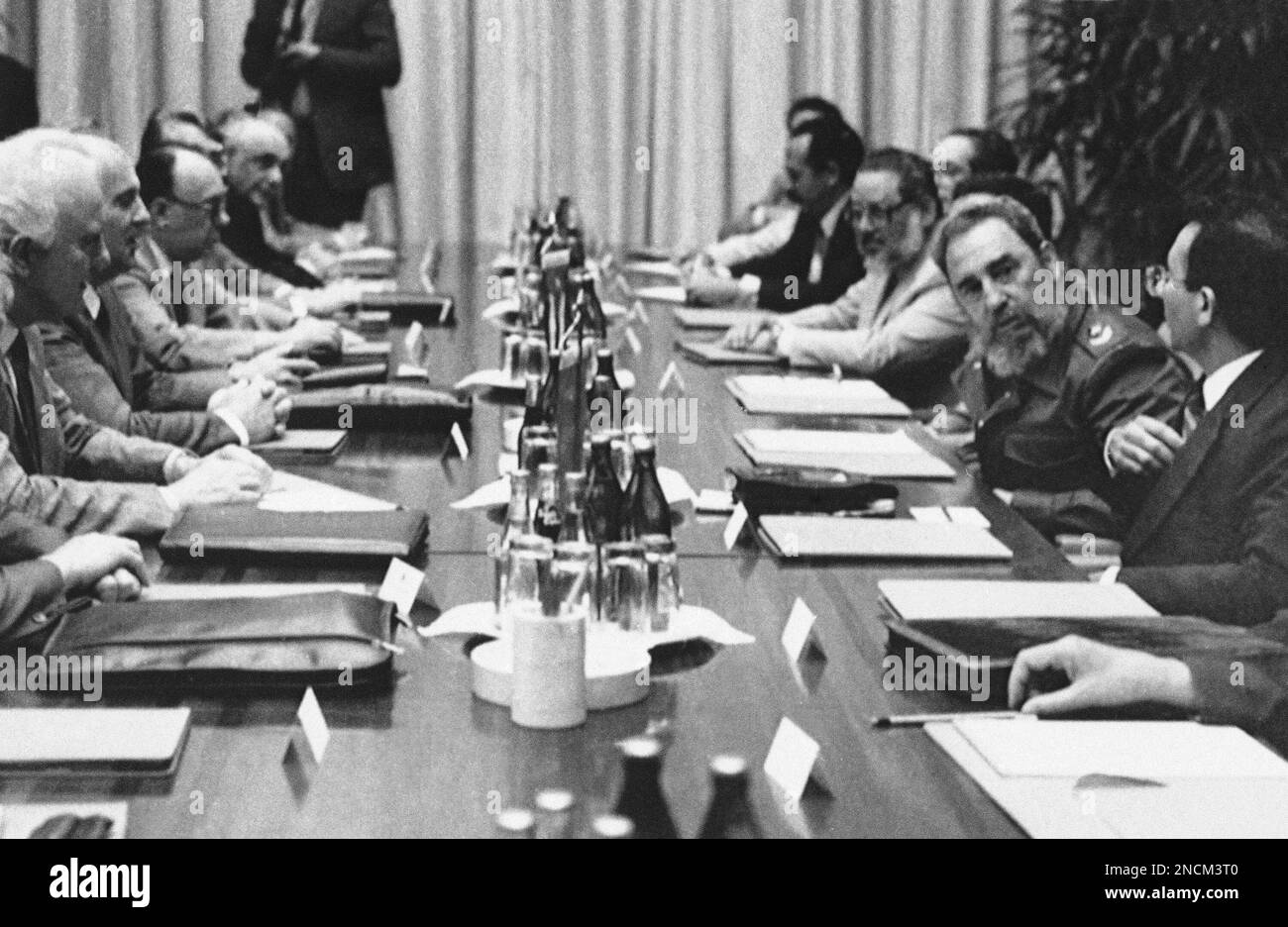 Cuban President Fidel Castro is seated across the table from Soviet ...
