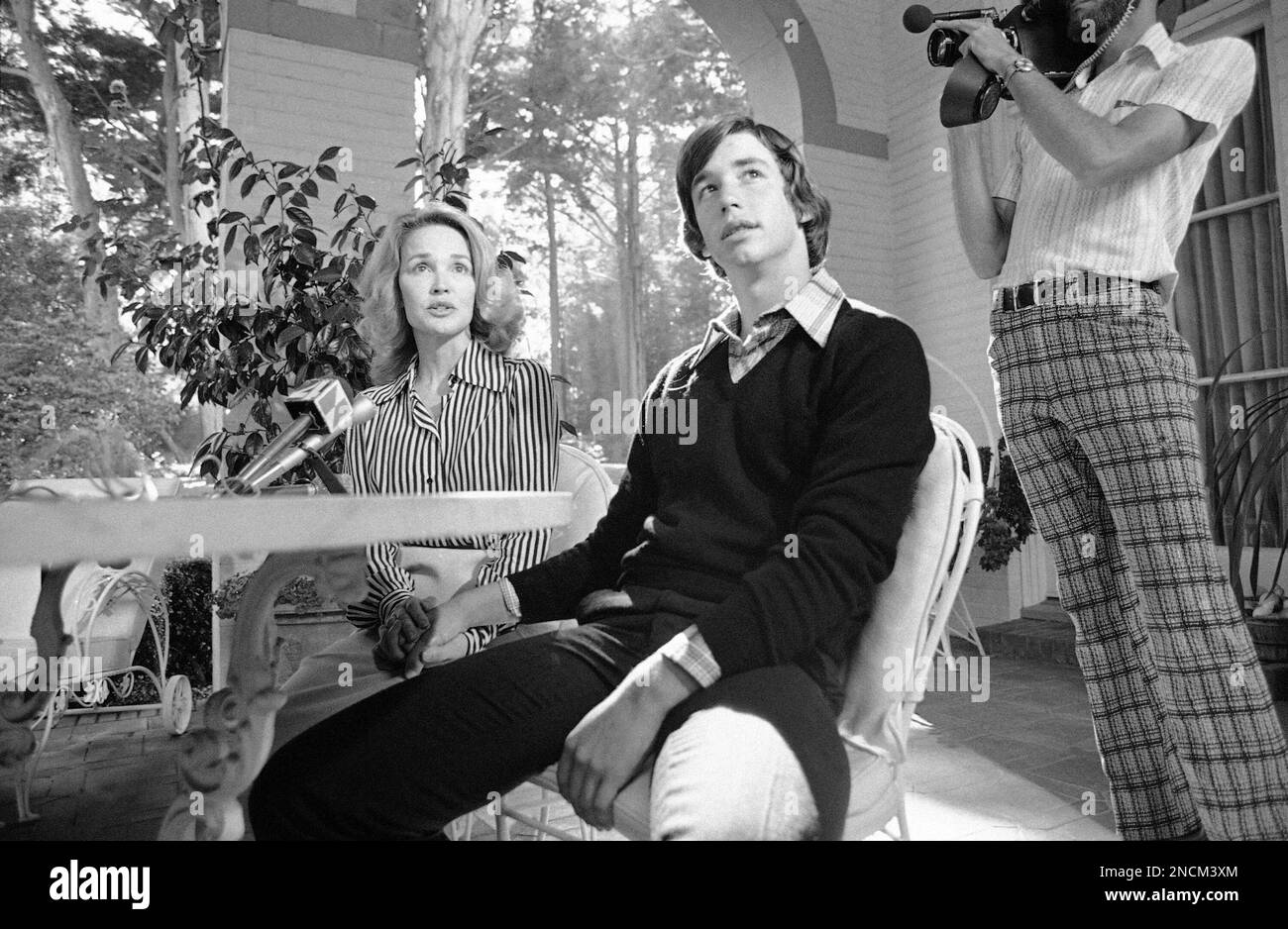 Nathaniel Crosby holds the hand of his mother, Kathryn, as they meet ...