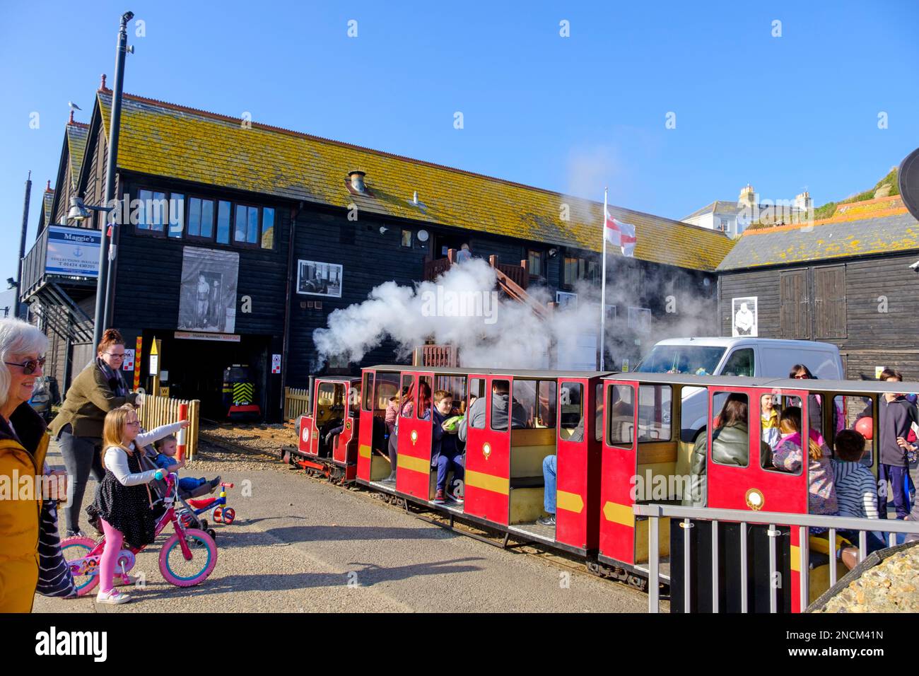 People enjoying miniature train ride along seafront in Hastings ...