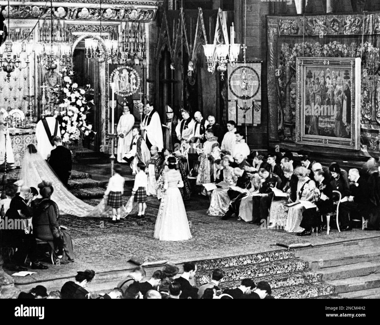 Britain's Princess Elizabeth and the Duke of Edinburgh kneel before the ...