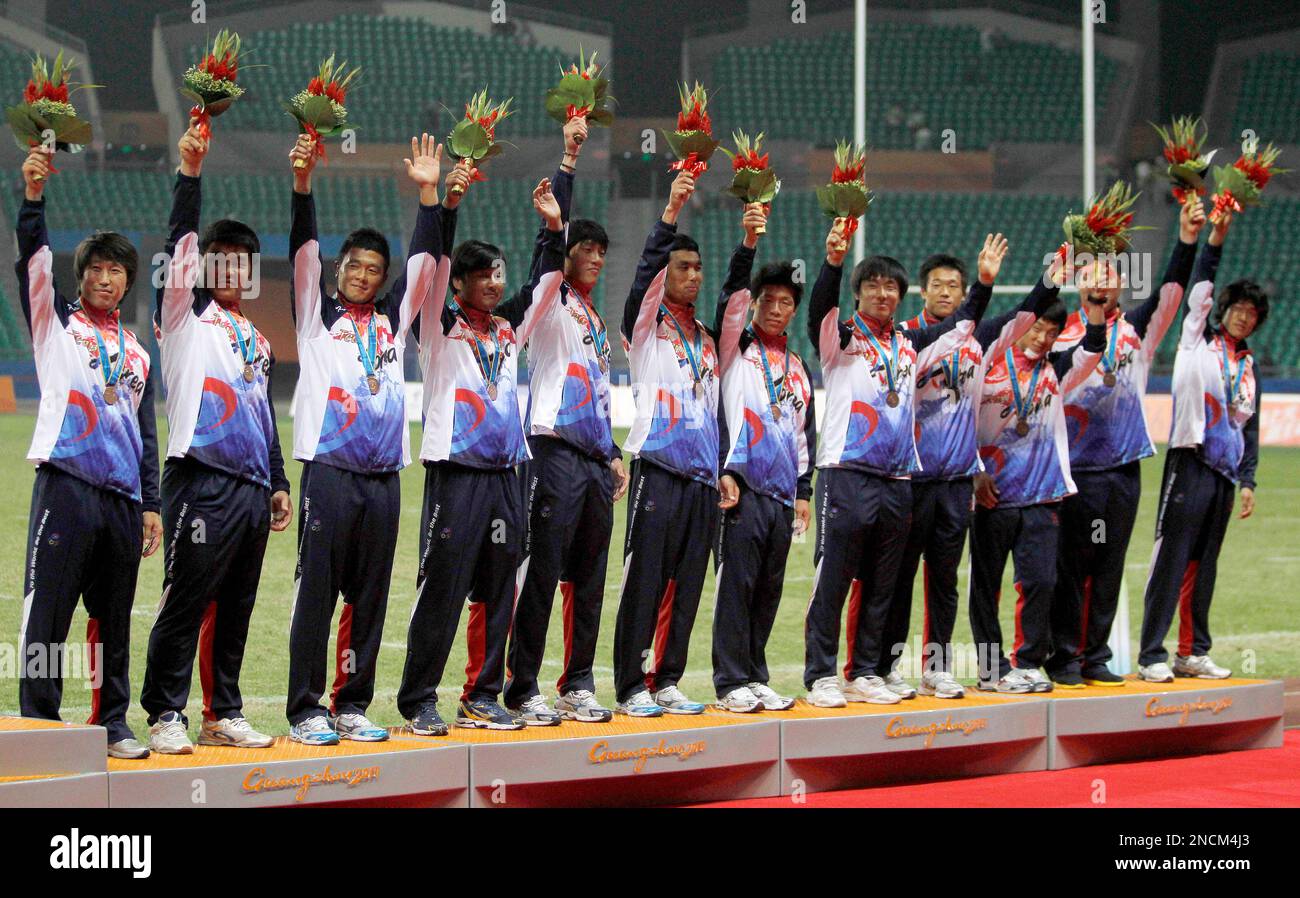 South Korea's team celebrate with their bronze medals during a medal ...