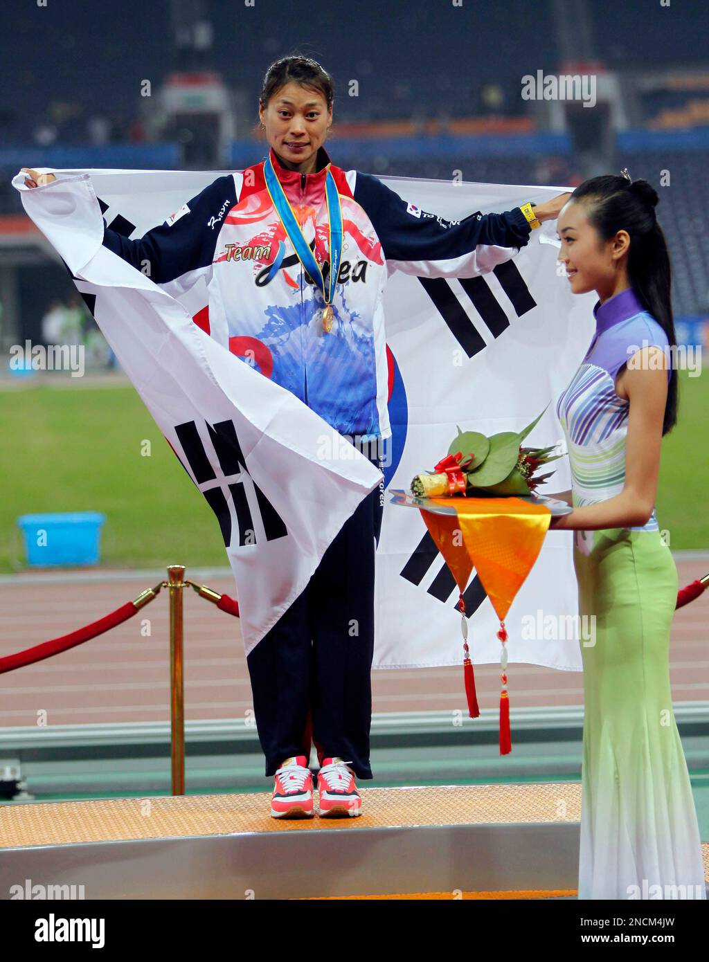 South Korea's Jung Soonok celebrates on the podium the gold medal she ...