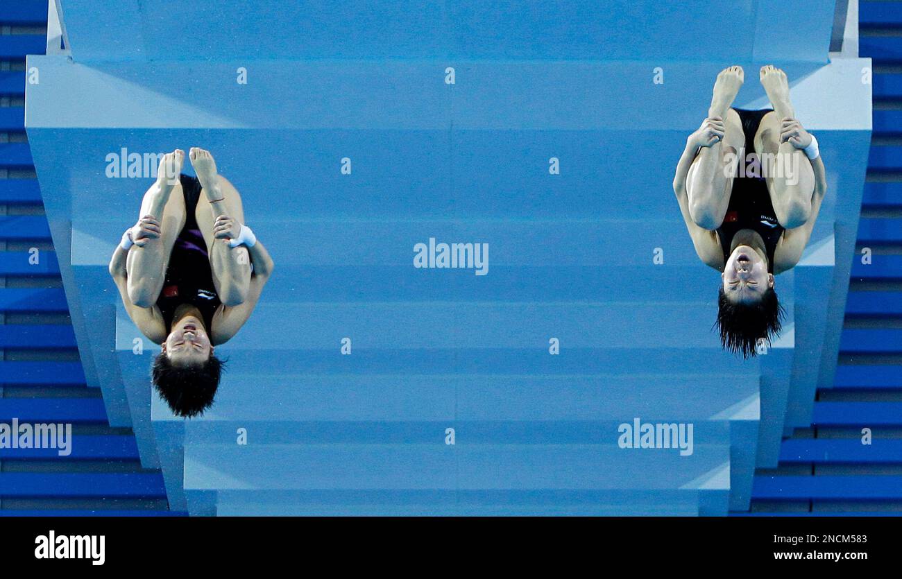Ruolin Chen and Hao Wang of China jump during the women's synchronized ...