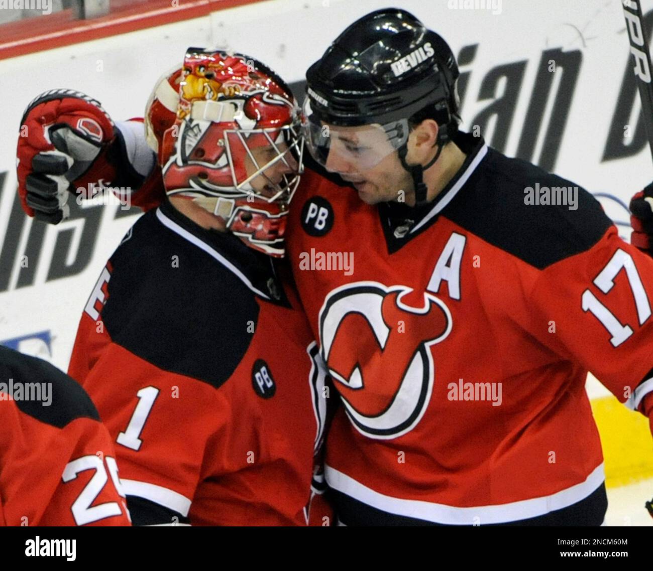 New Jersey Devils' Ilya Kovalchuk, right, of Russia, hugs goaltender ...