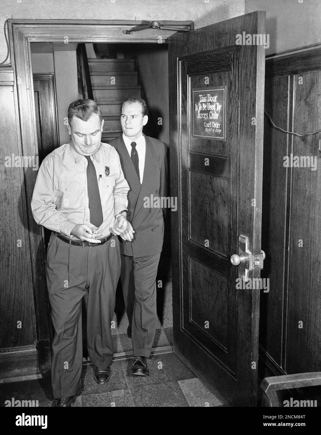 Dr. Samuel H. Sheppard, right, as he entered the courtroom of Judge ...