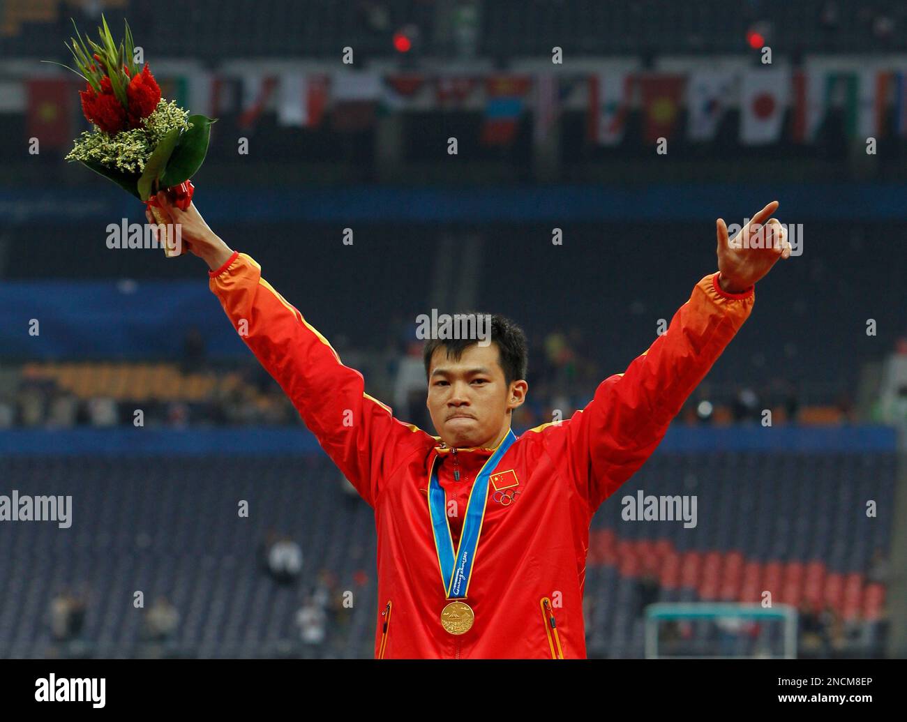 China's Lao Yi celebrates his gold medal after winning the men's 100m ...