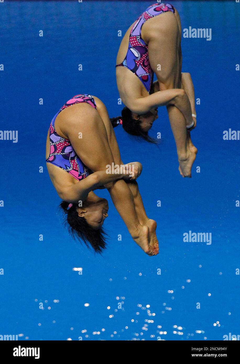 Japan's Mai Nakagawa, left, Sayaka Shibusawa compete in in the women's 3 meter synchronized ...