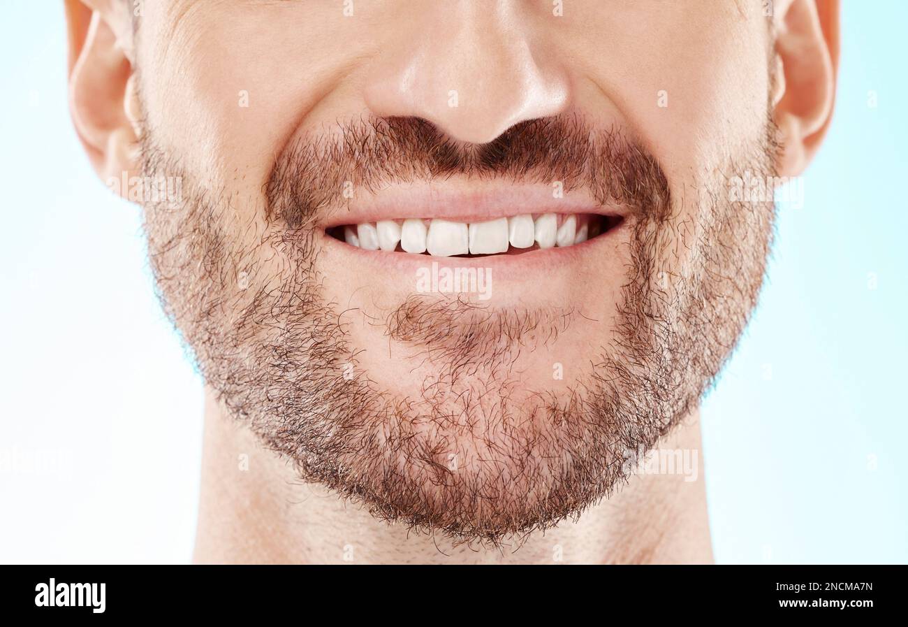 Teeth, smile and mouth of a man for dental care isolated on a blue ...