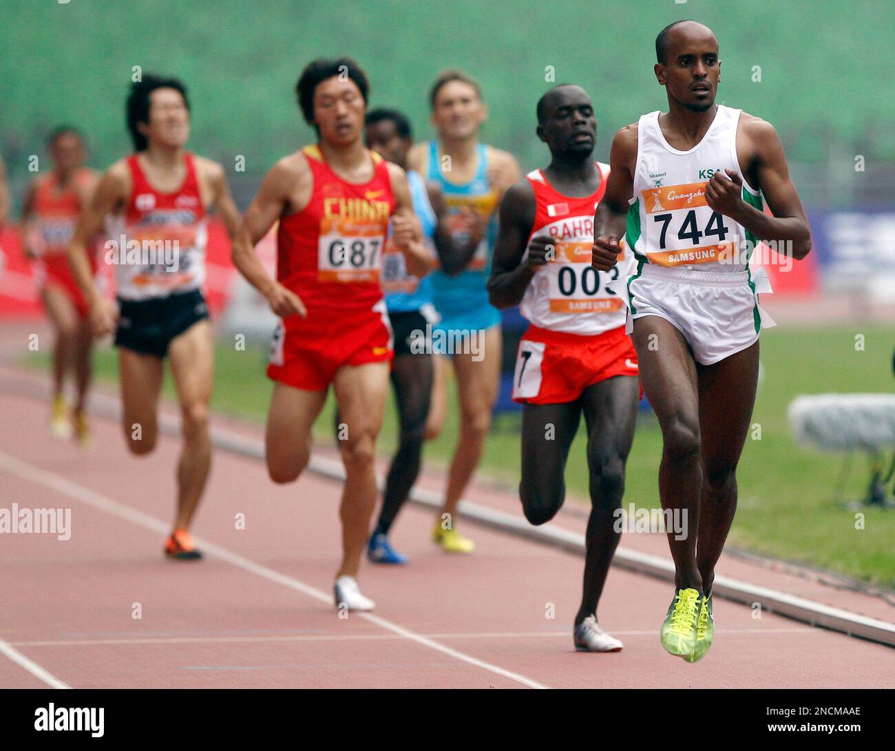 Saudia Arabia's Mohammed Othman H Shaveen, right, wins a men's 1500m ...