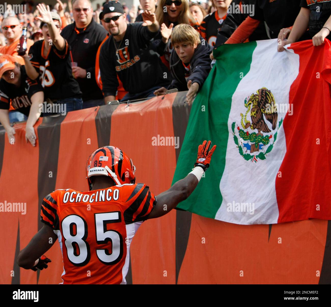 Cincinnati Bengals wide receiver Chad Ochocinco touches a Mexican flag ...
