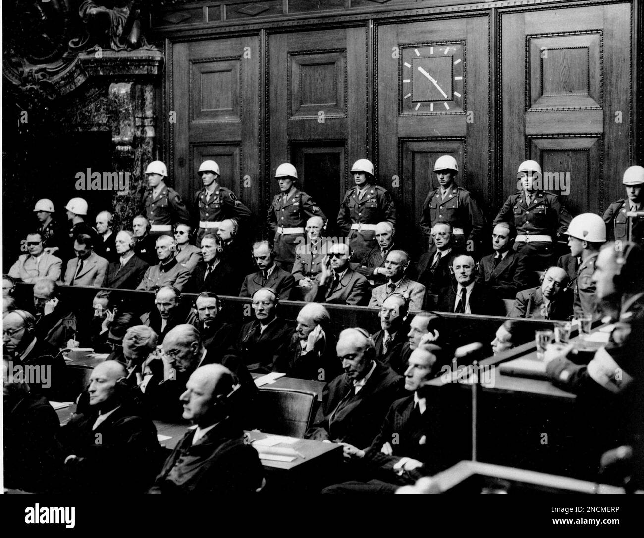 FILE - In this Sept. 30, 1946 b/w file picture defendants hear parts of ...