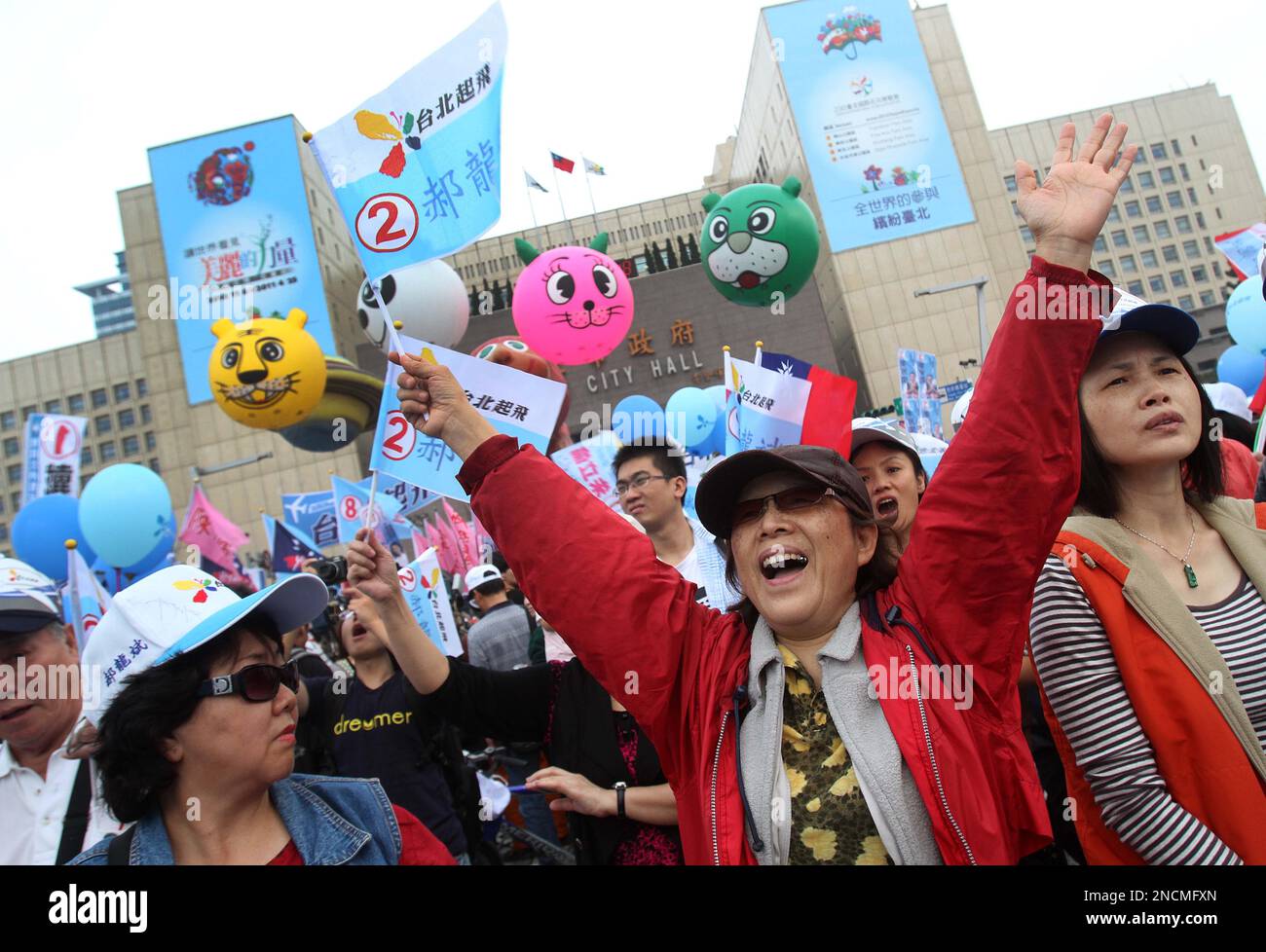 Supporters of Nationalist Party mayoral candidate Hau Ling-bin shoot ...