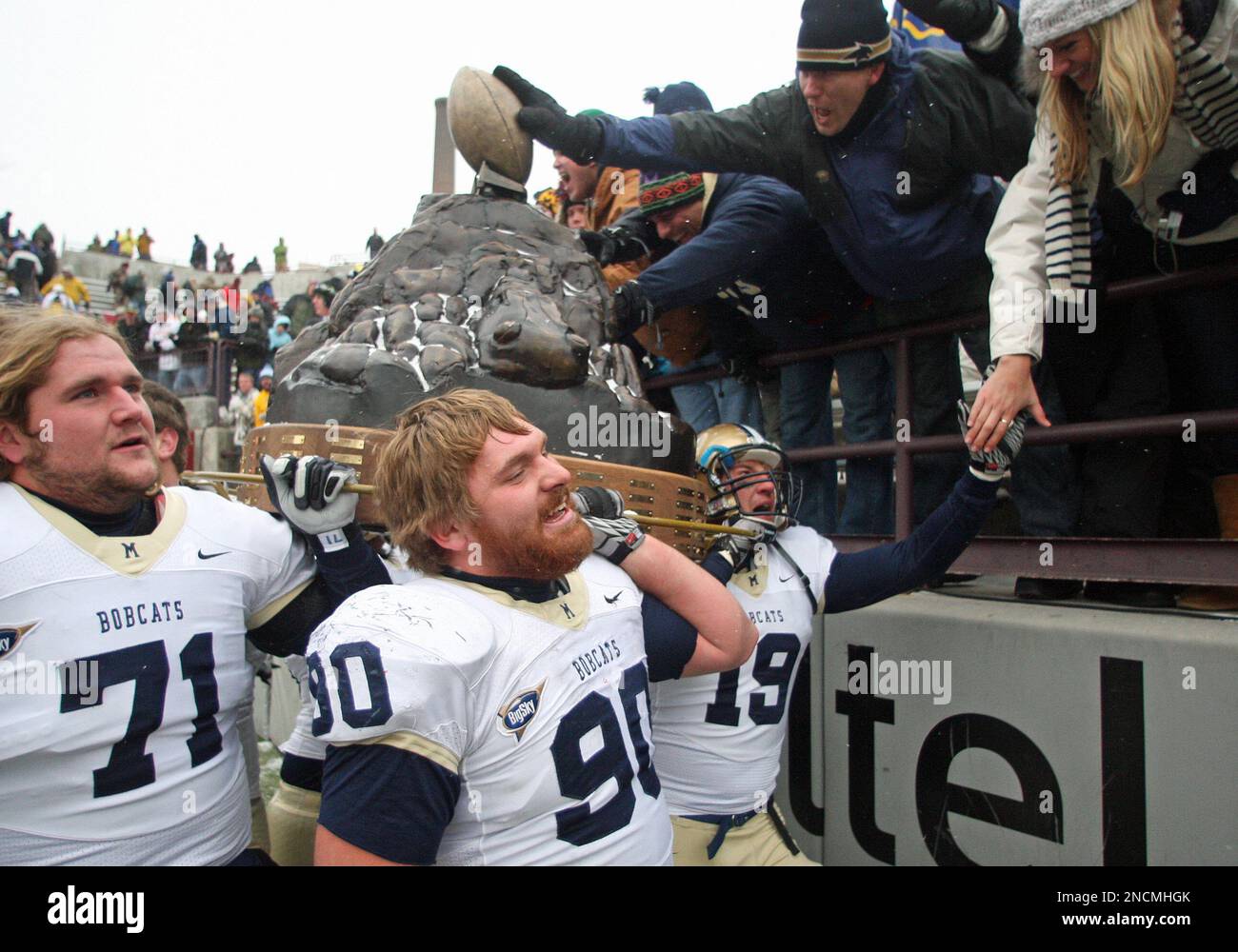 Montana State players Jesse Hoffman (71), Dan Ogden (90), and Rick ...