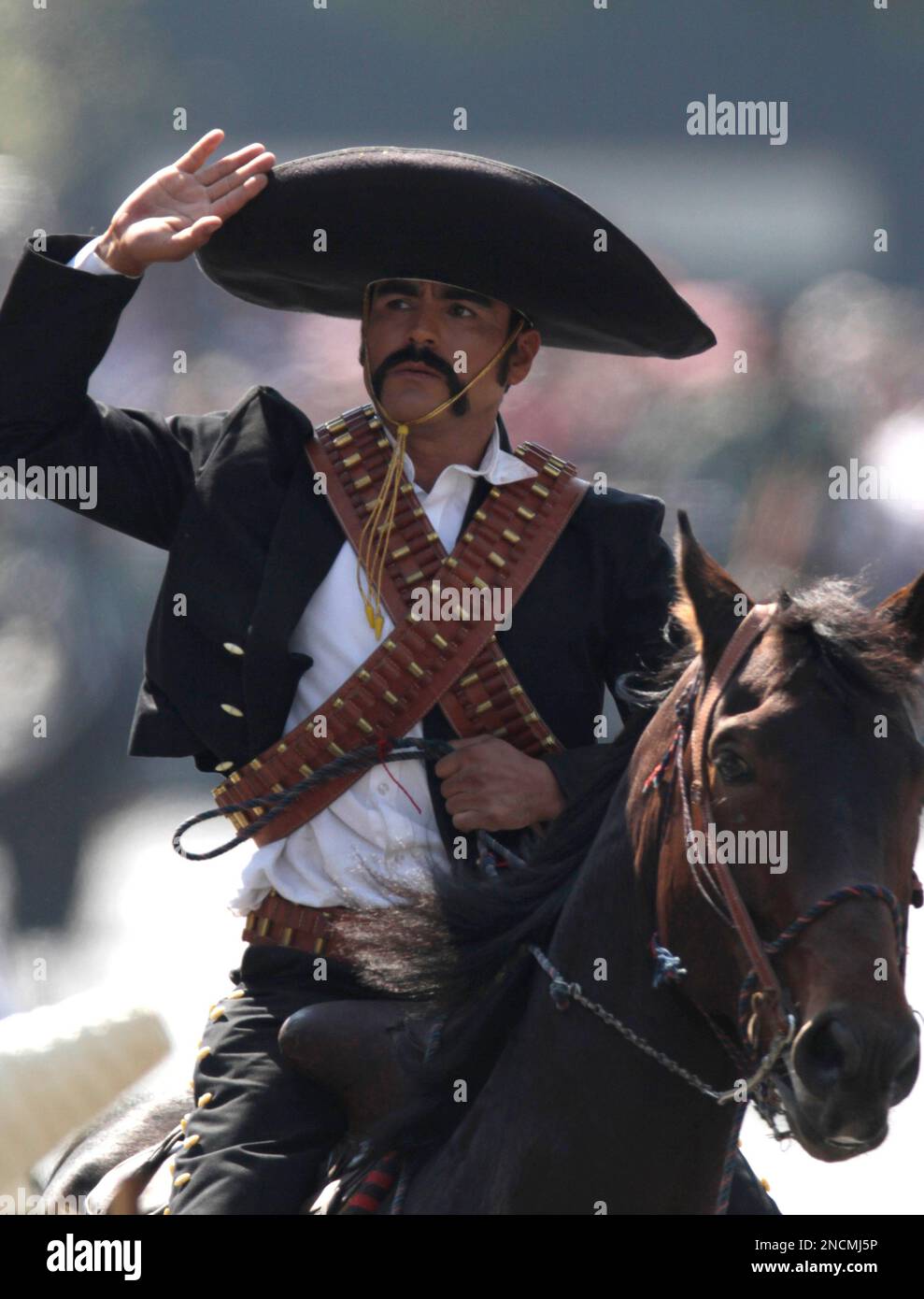 A man dressed as Mexican Revolution hero Emiliano Zapata performs ...