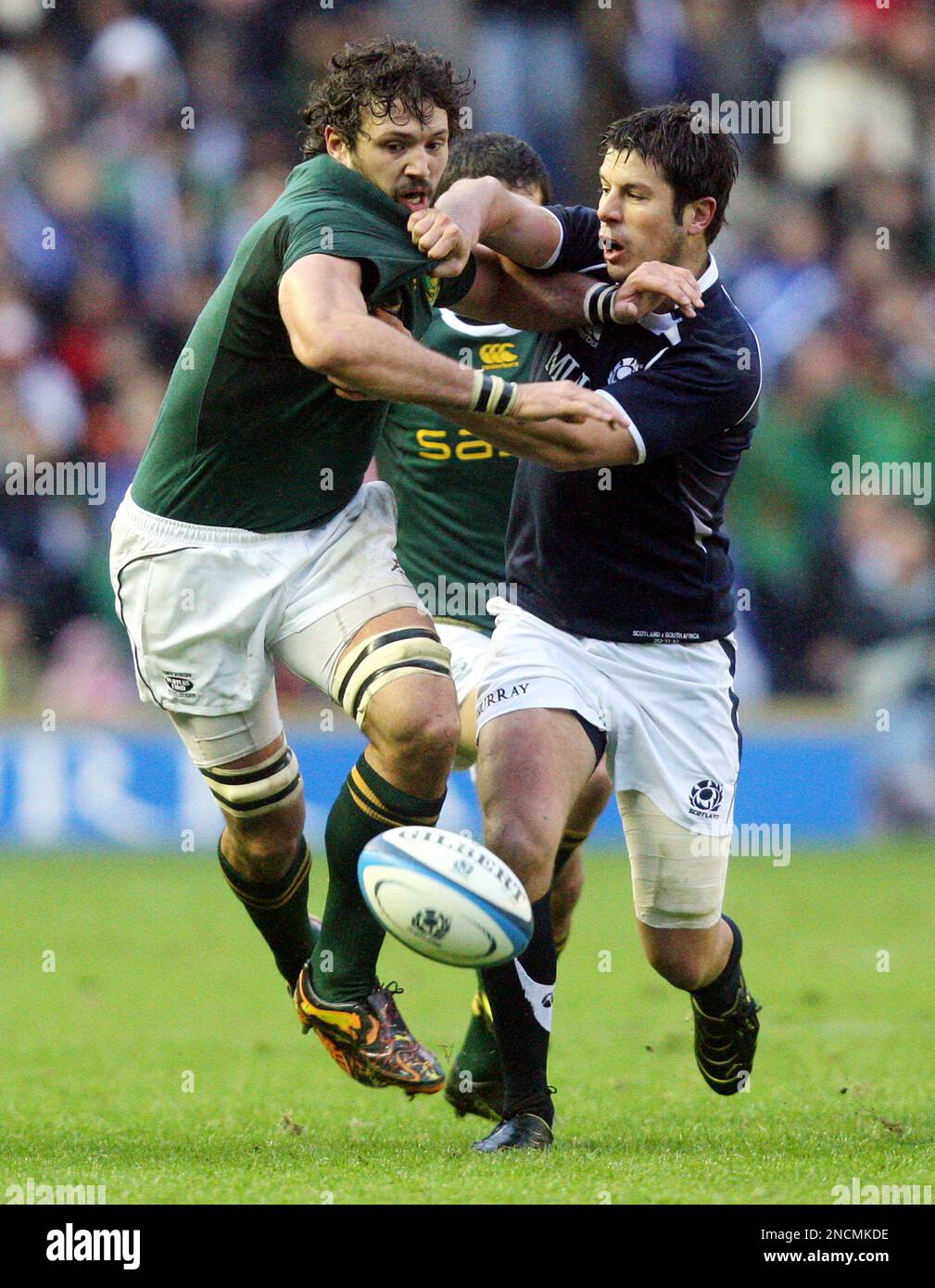 South Africa's Ryan Kankowski, left, is tackled by Scotland's Hugo ...