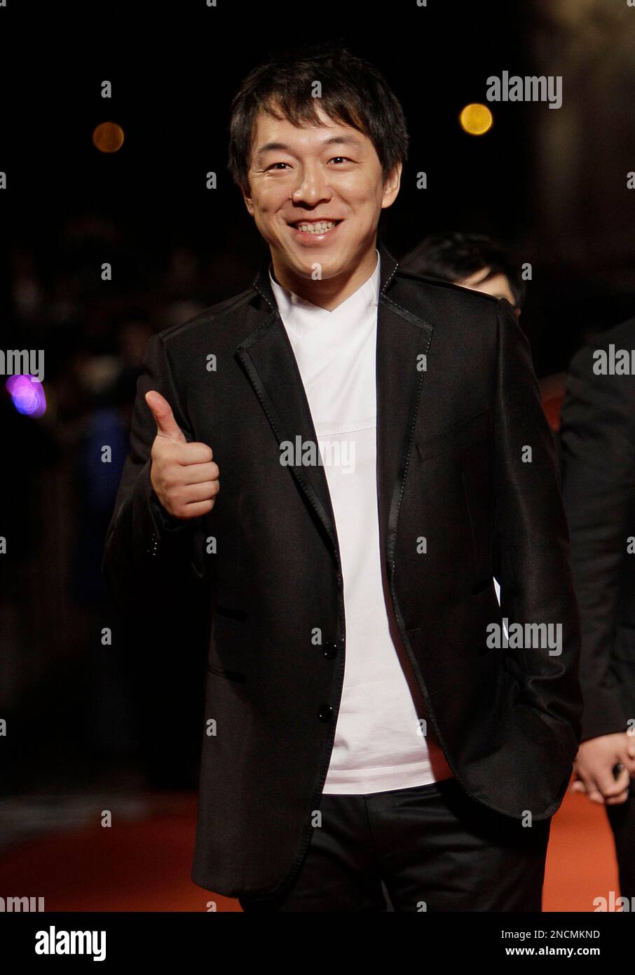 Chinese actor Huang Bo poses on the red carpet at the 47th Golden Horse ...