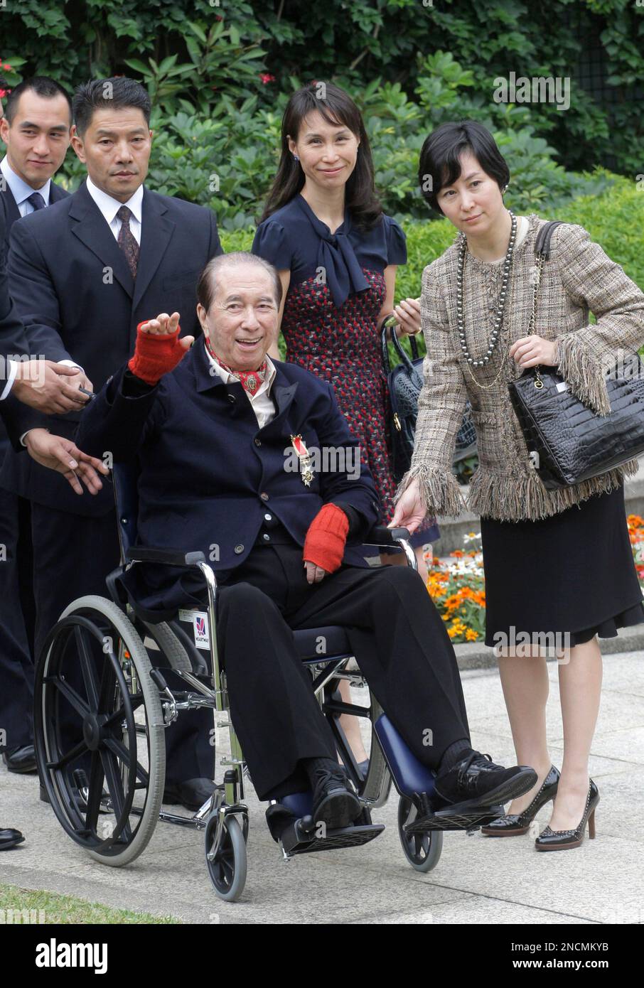Hong Kong and Macau tycoon Stanley Ho, center, poses with his family ...