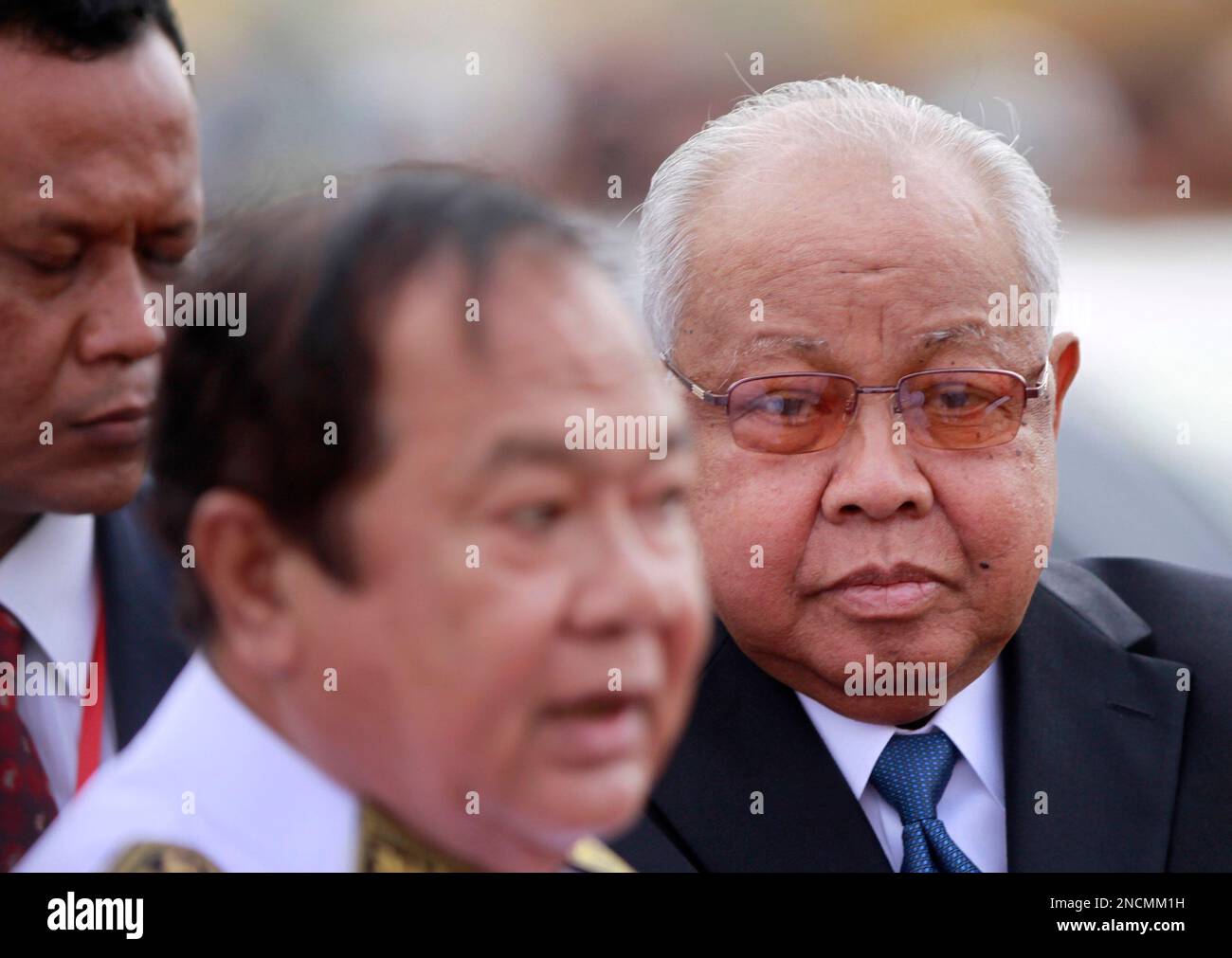 Cambodia's Senate President Chea Sim, right, attends a water festival ...