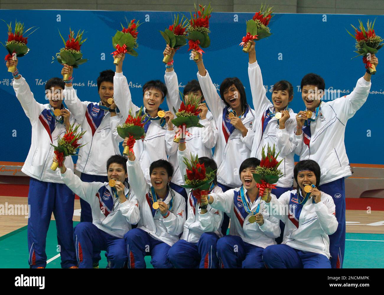 Thailand's women's sepak takraw team celebrate on the podium with their ...