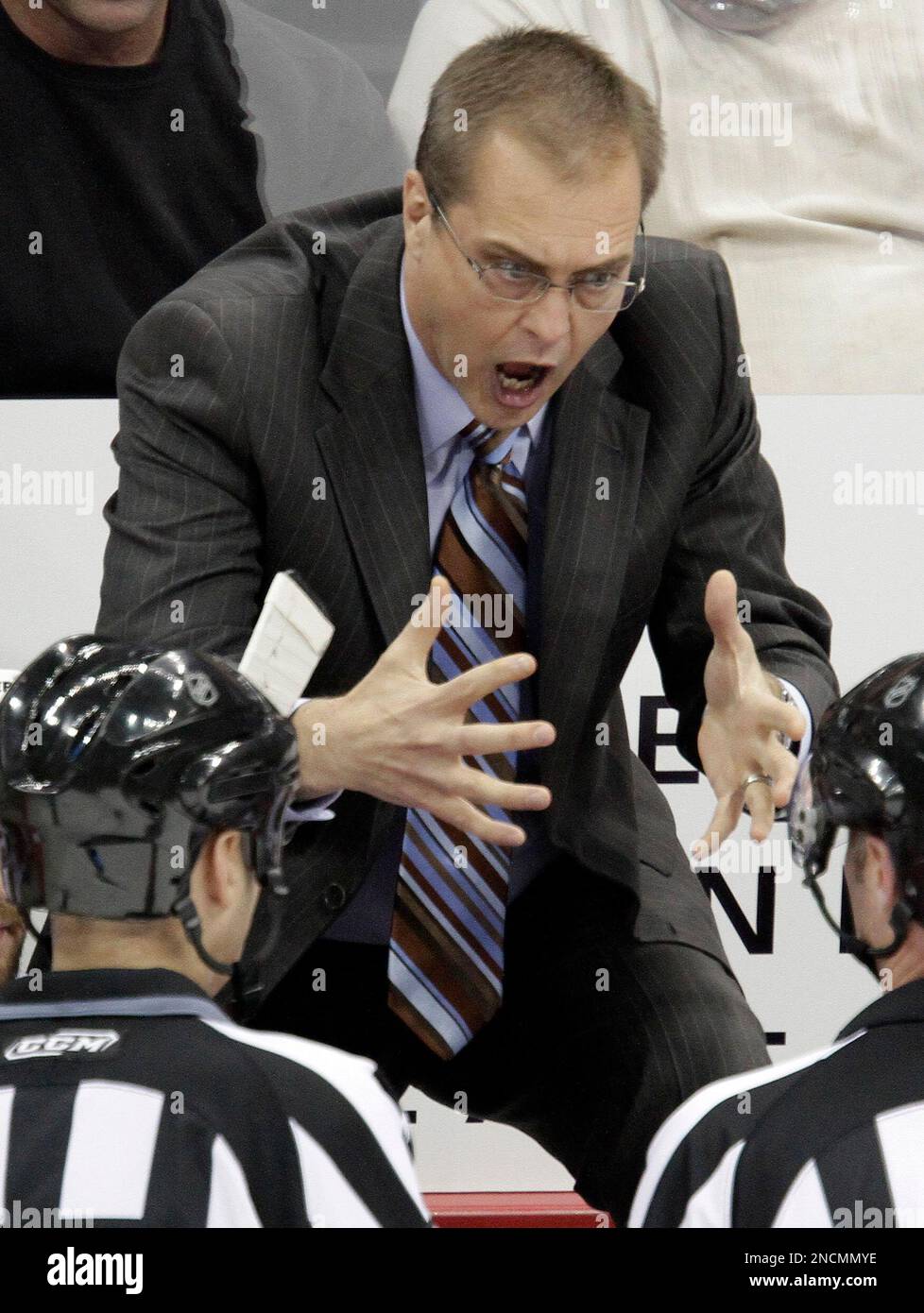 Carolina Hurricanes coach Paul Maurice makes his point to referee Greg ...