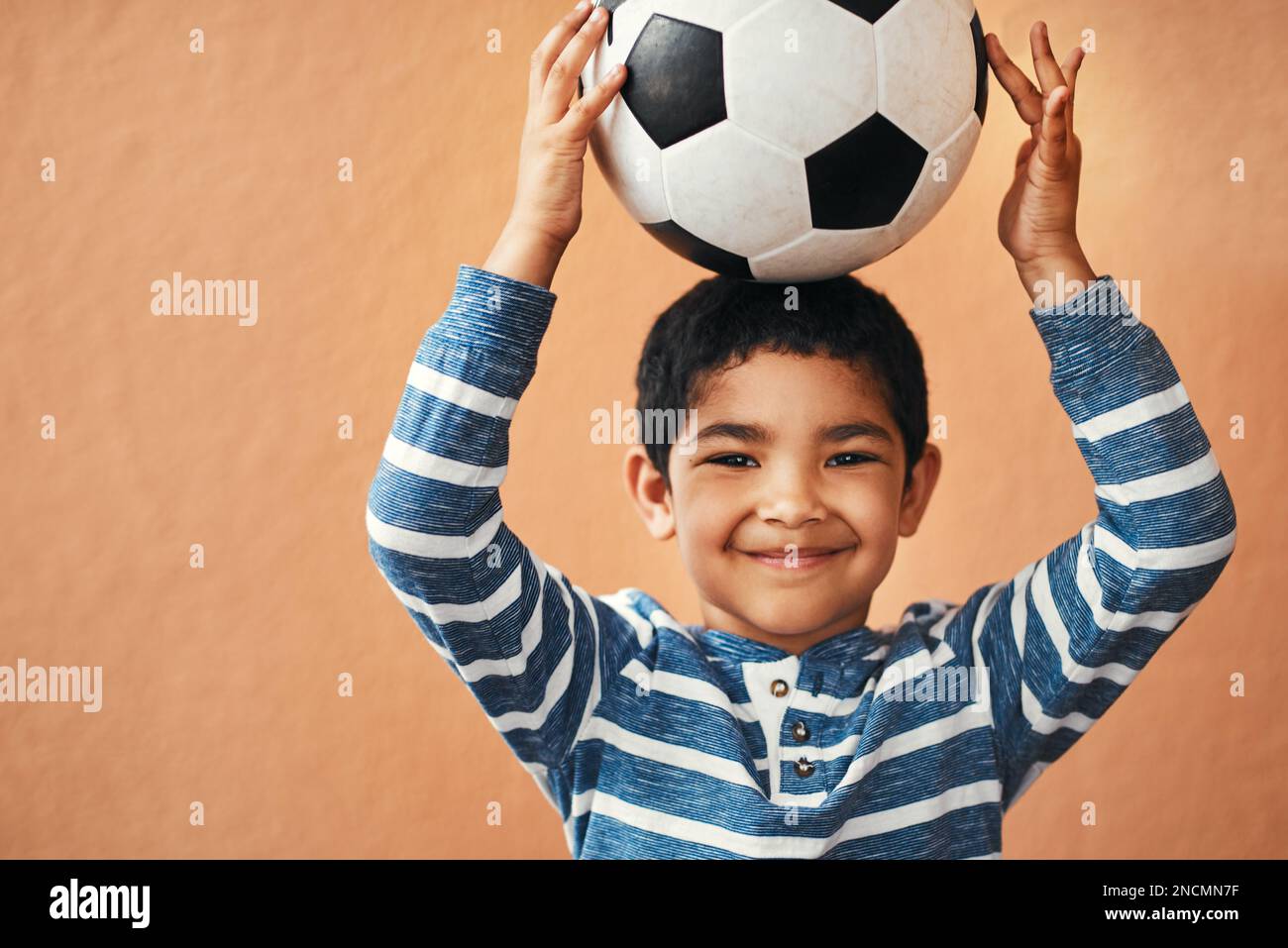 The cutest soccer player. Portrait of an adorable little boy posing ...