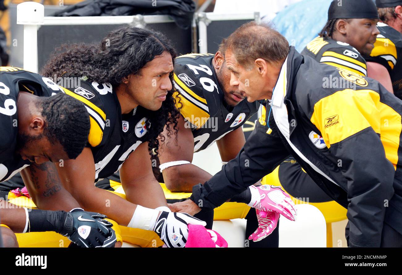 In this Oct. 3, 2010 photo, Neurosurgeon Dr. Joseph Maroon, right, team ...