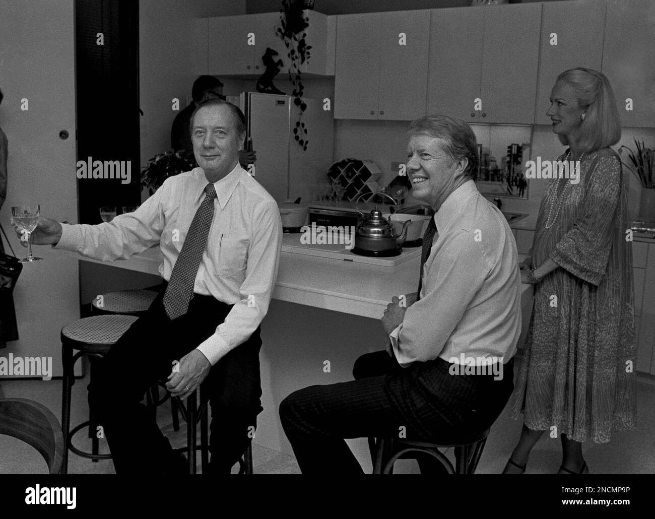 Chicago Mayor Michael Bilandic raises a glass as President Jimmy Carter ...
