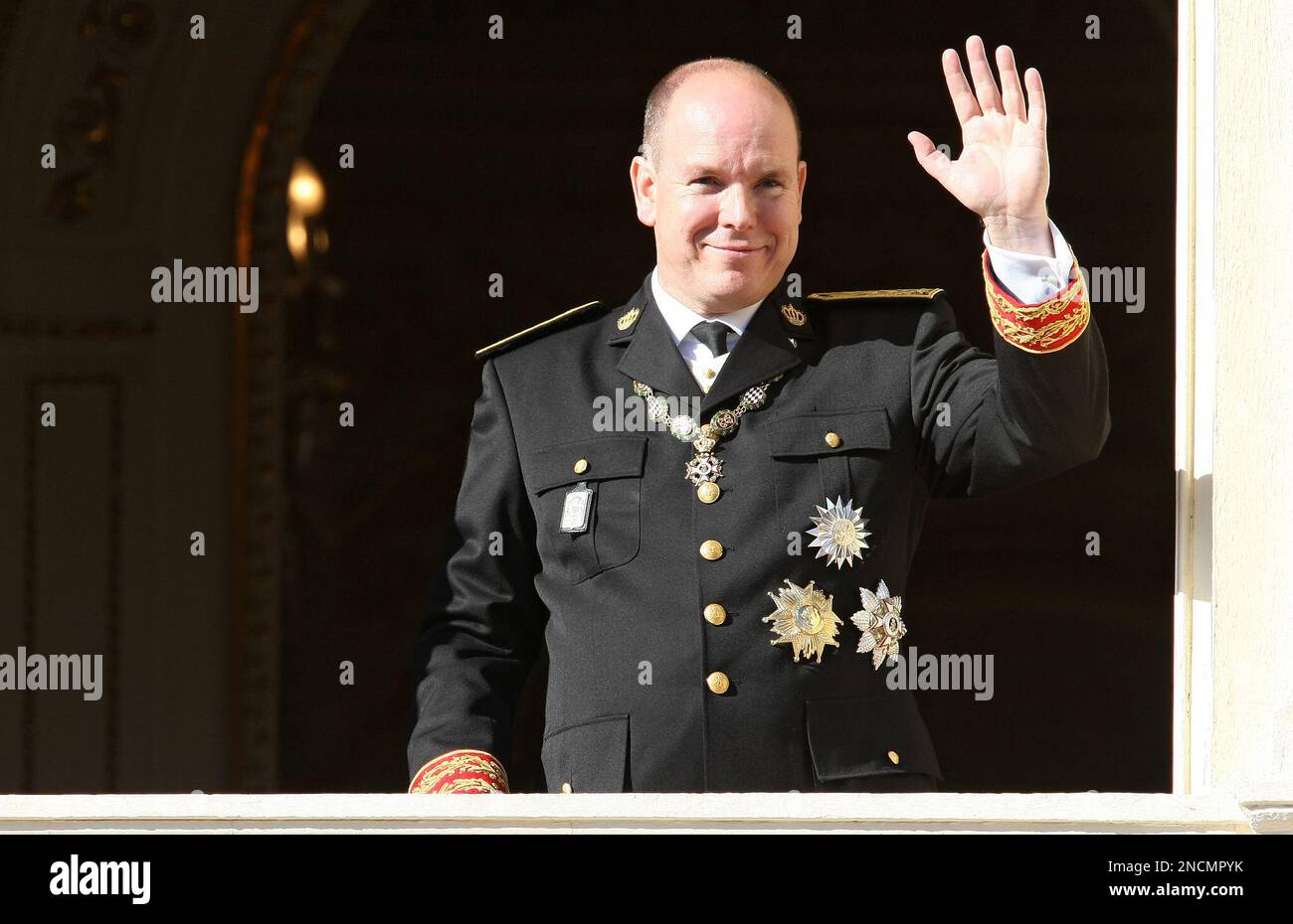 Prince Albert II of Monaco stands on the balcony of the Pink Palace in ...