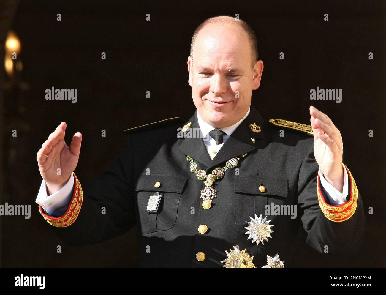 Prince Albert II of Monaco stands on the balcony of the Pink Palace in ...