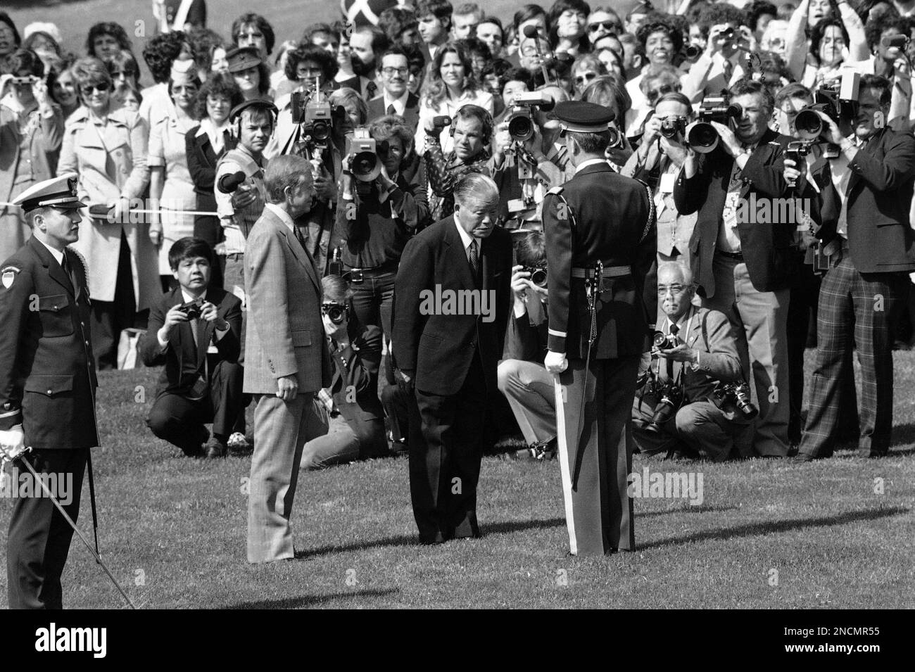 President Jimmy Carter looks on as Japan’s Prime Minister Masayoshi ...
