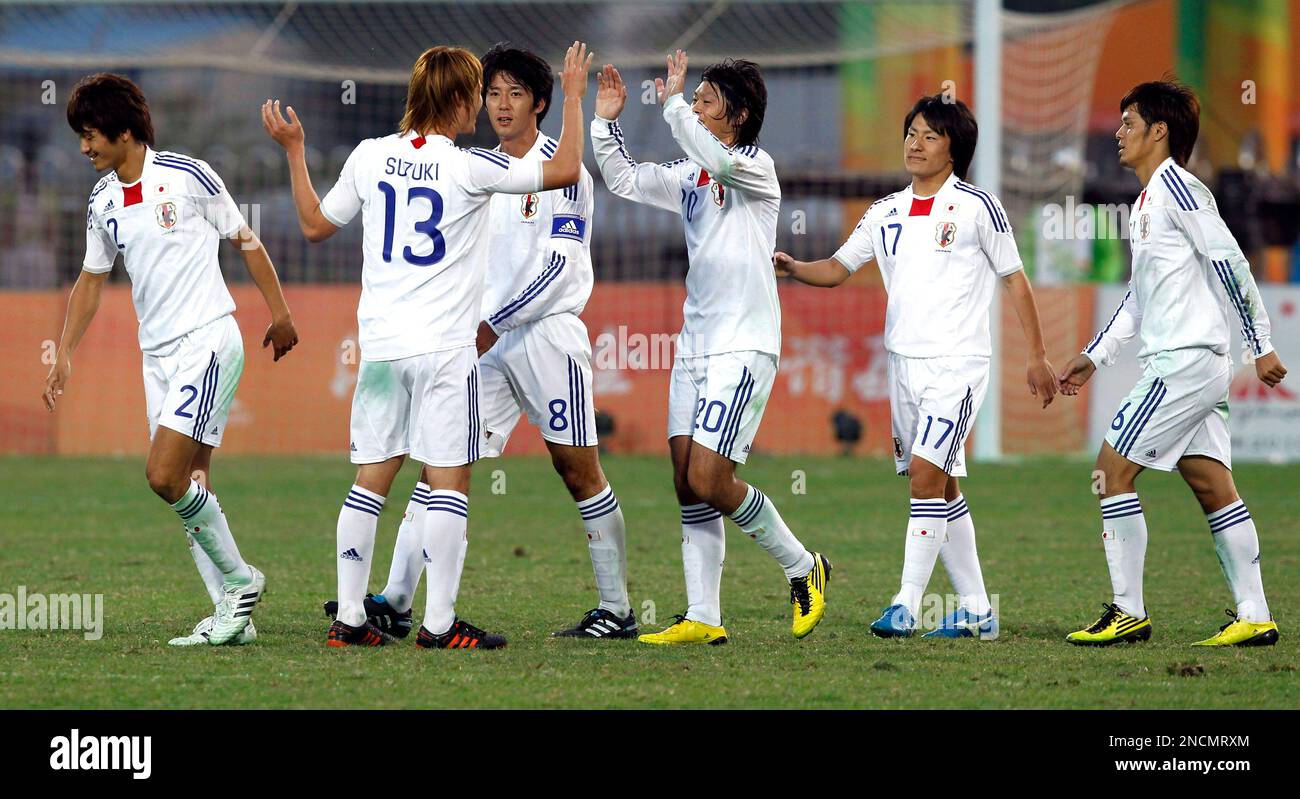Japan team players celebrate after defeating Thailand 1-0 in the Men's ...