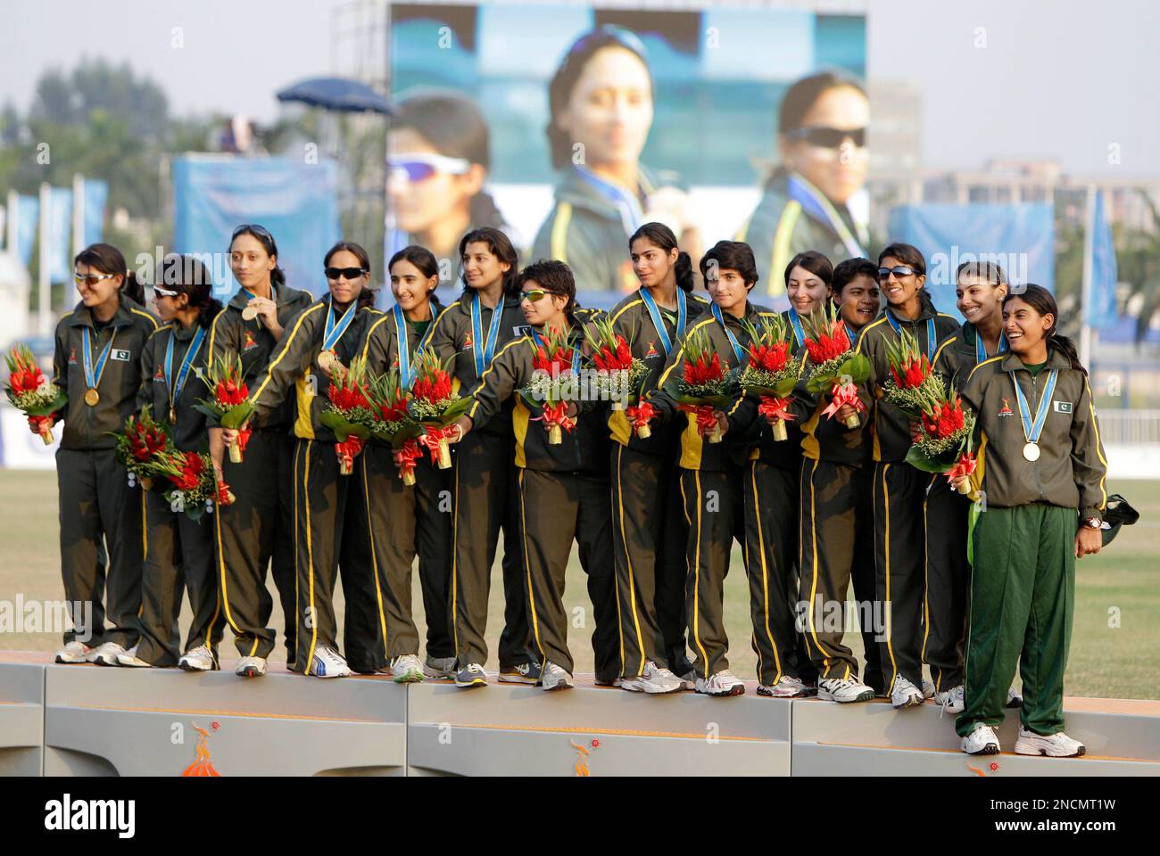 The Pakistan celebrate on the podium after receiving their gold medal ...