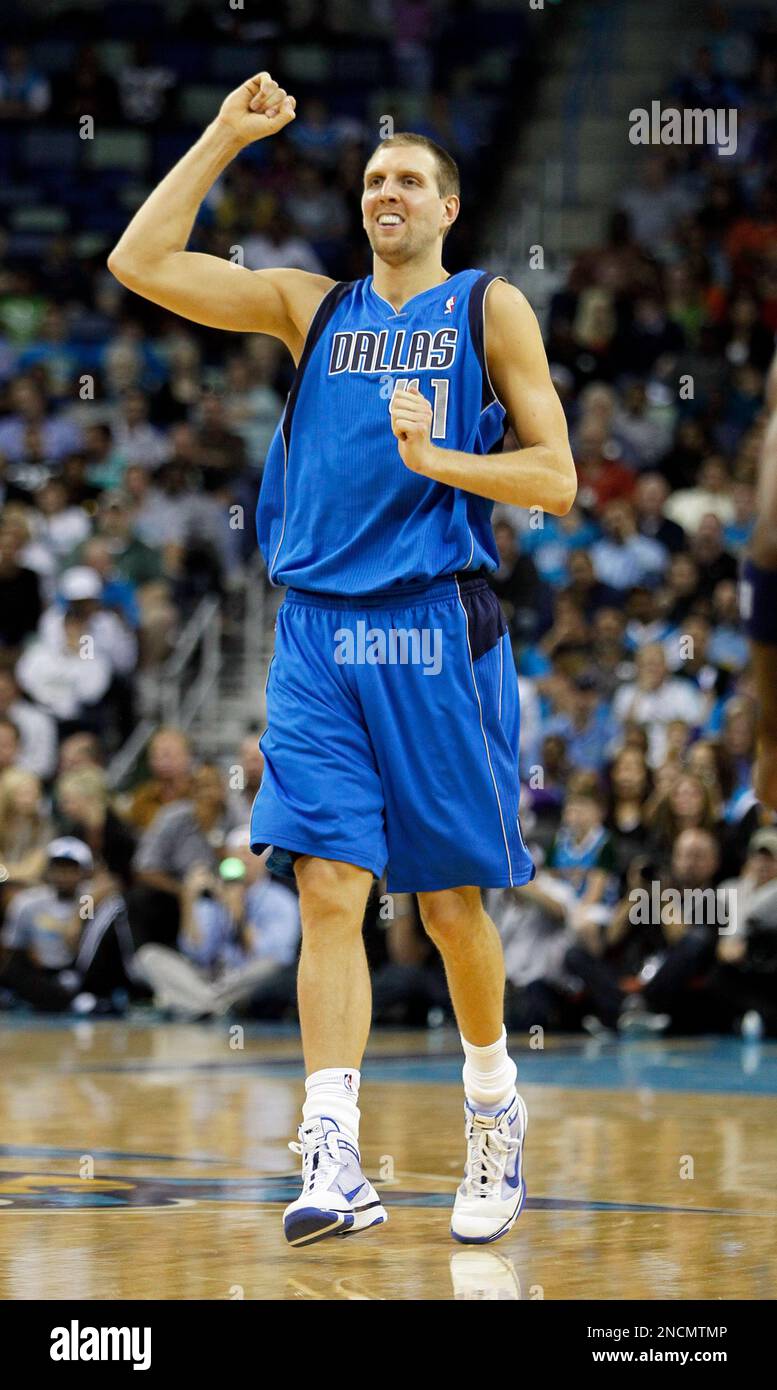 Dallas Mavericks power forward Dirk Nowitzki, of Germany, reacts after ...