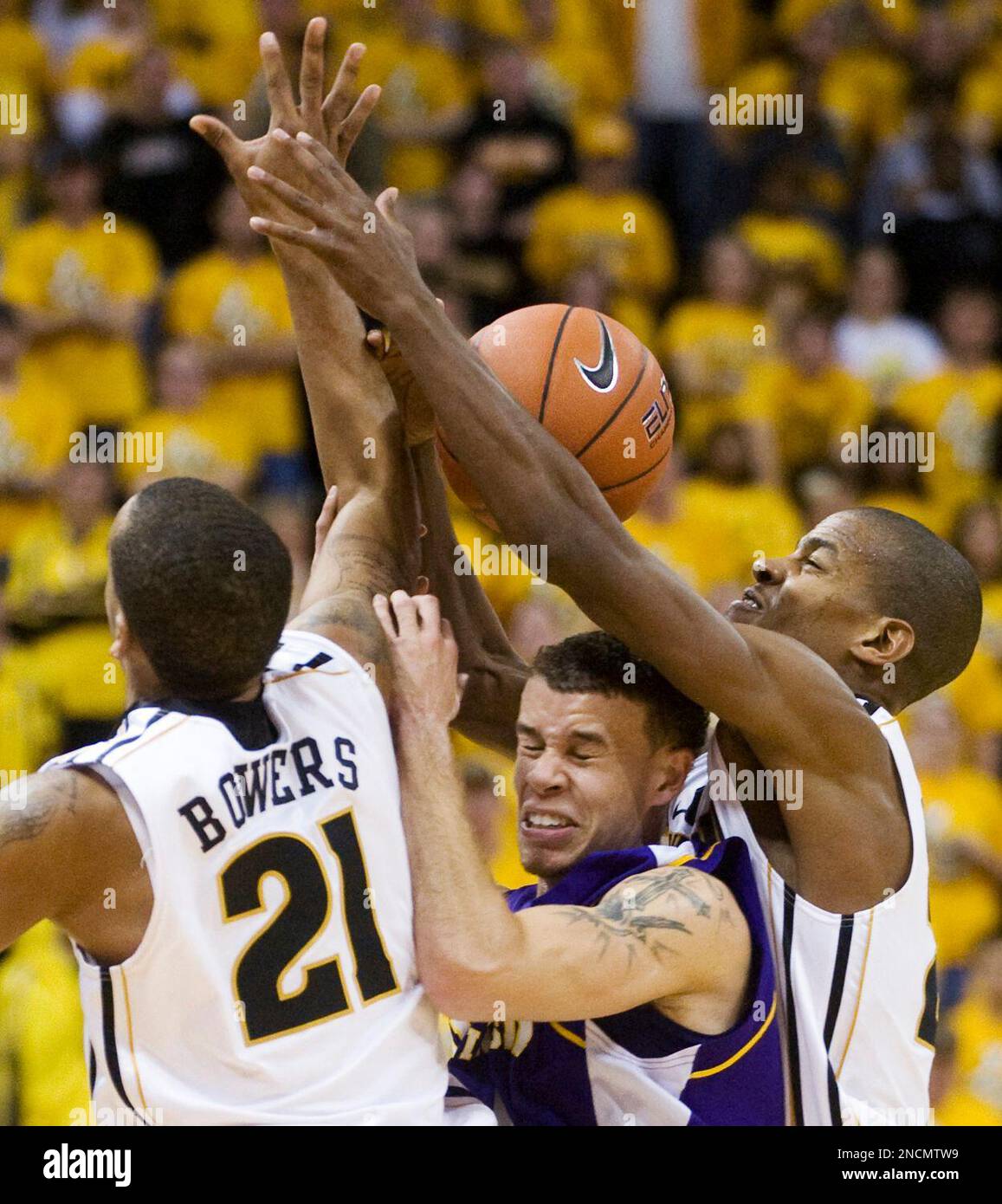 Western Illinois' Matt Lander, center, has the ball stripped by ...