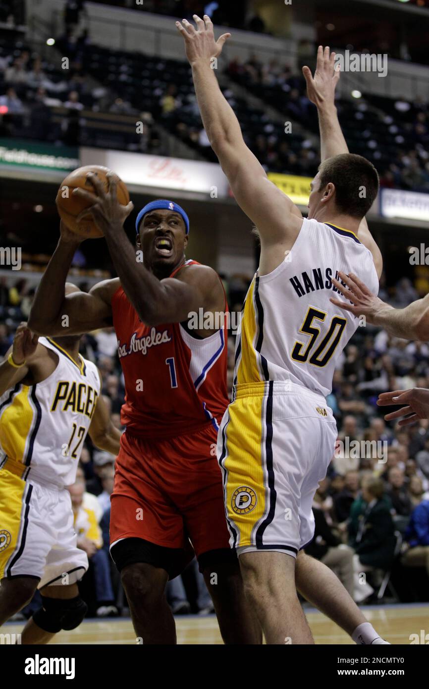 Los Angeles Clippers forward Craig Smith, left, looks to shoot under ...