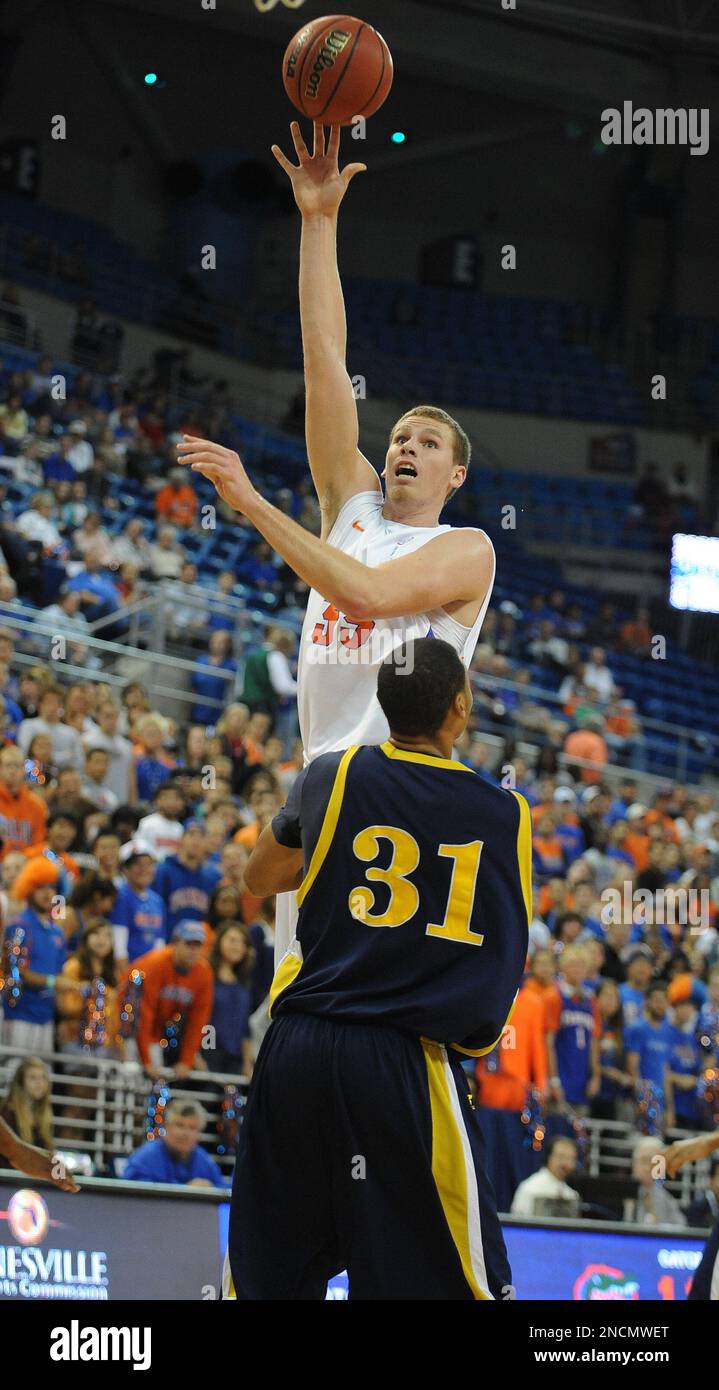 Florida forward Erik Murphy (33) goes for two points against North ...
