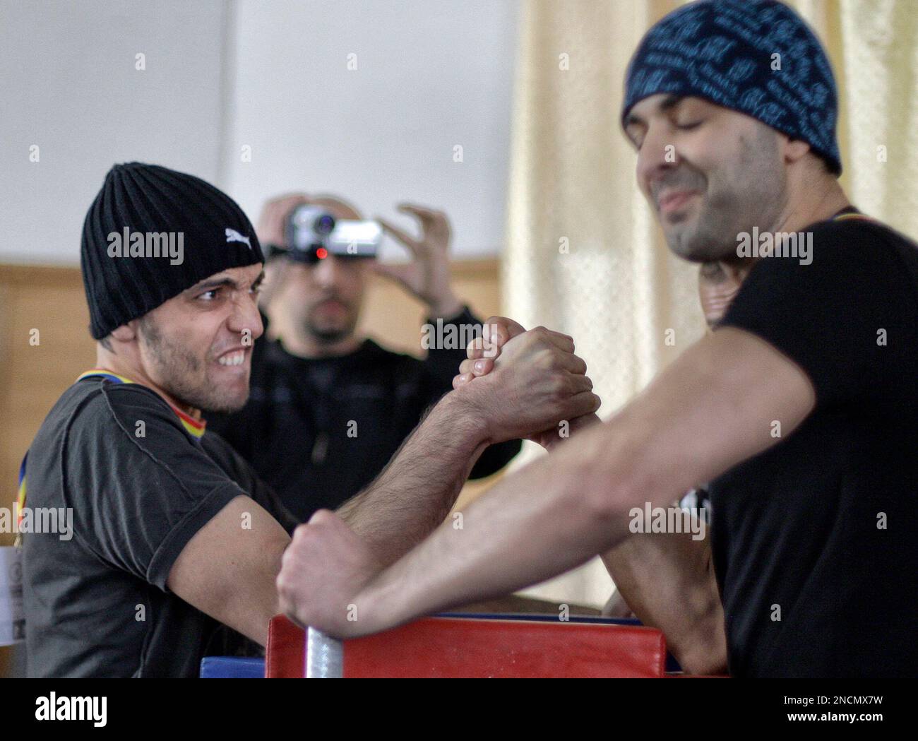 Inmates of the Rahova prison compete during an arm wrestling ...
