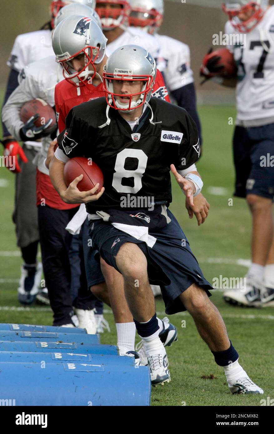 New England Patriots quarterback Brian Hoyer, front, leads teammates ...