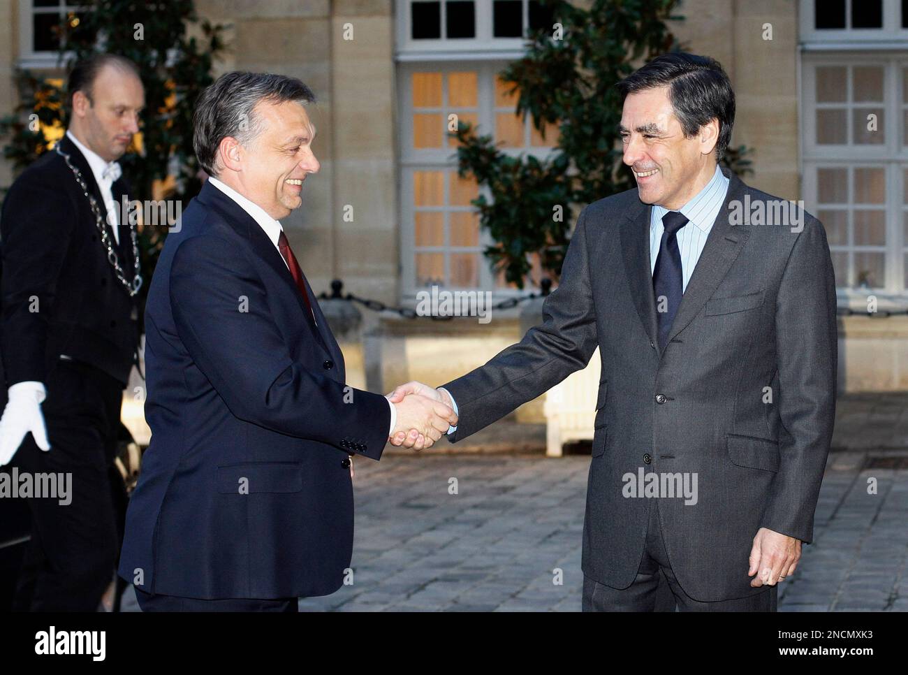 Hungarian Prime Minister Viktor Orban, left, is greeted by French Prime ...
