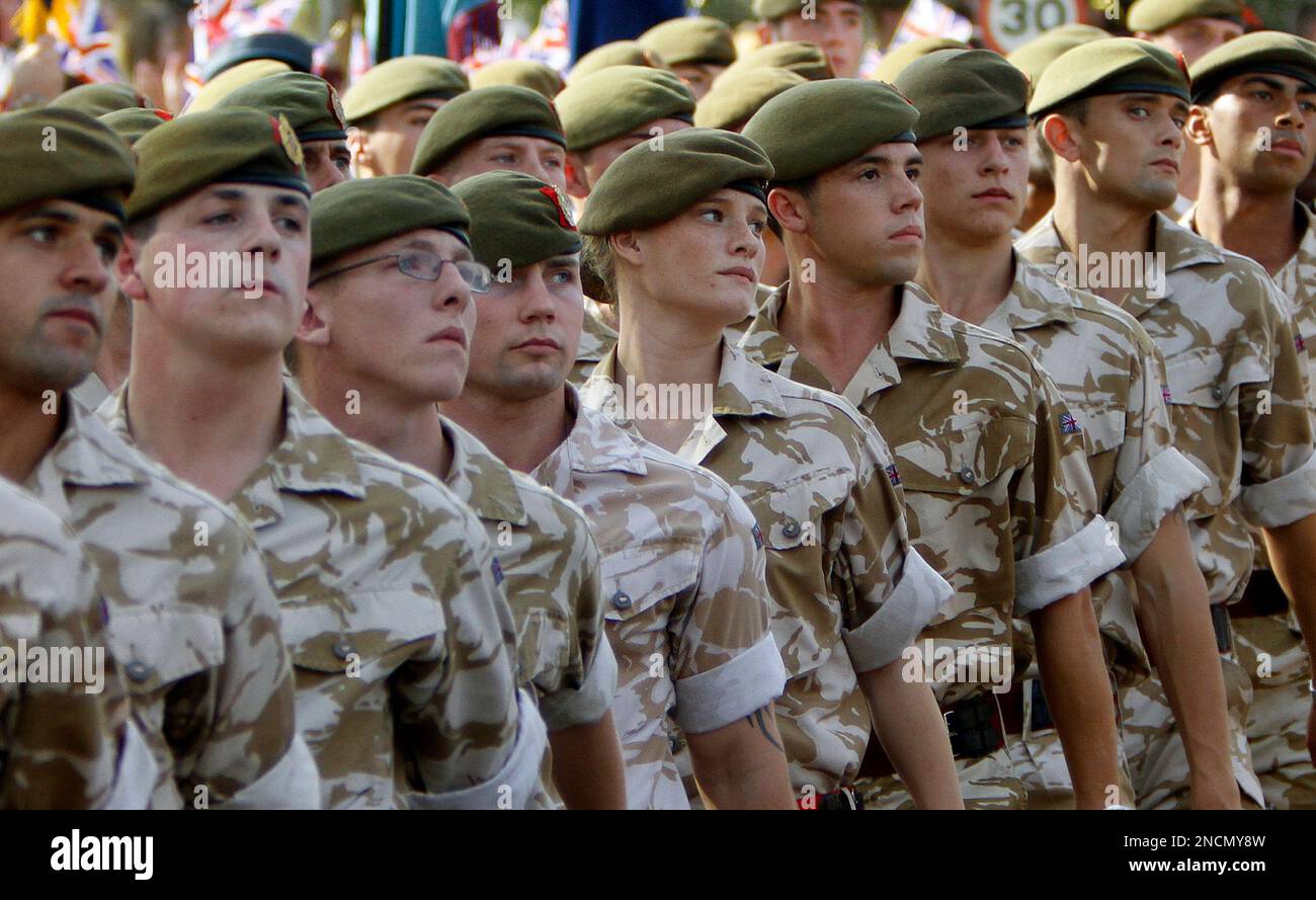 British soldiers march during a parade to mark the return of Britain's ...