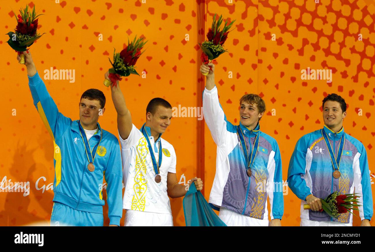 Kazakhstan's team, from left, Stanislav Ossinskiy, Fedor Shkylyov, Stanislav Kuzmin and ...