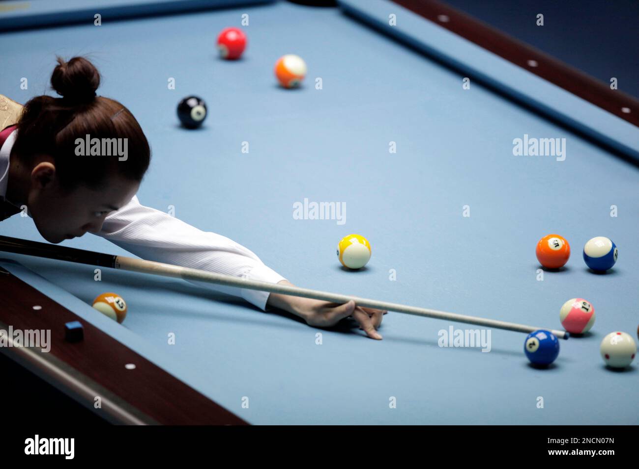 China's Liu Shasha lines up a shot during a semi-final match against ...